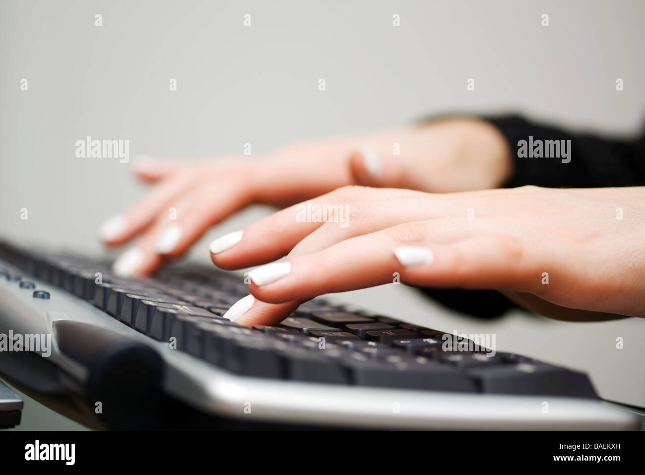 Female hands typing Stock Photo - Alamy