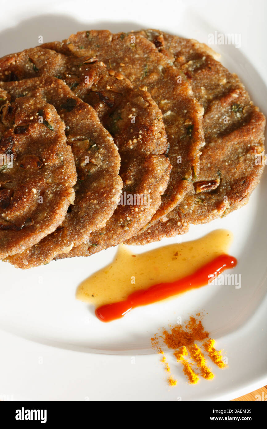 Thalipeeth is a type of savoury multi grain spiced pancake popular in ...