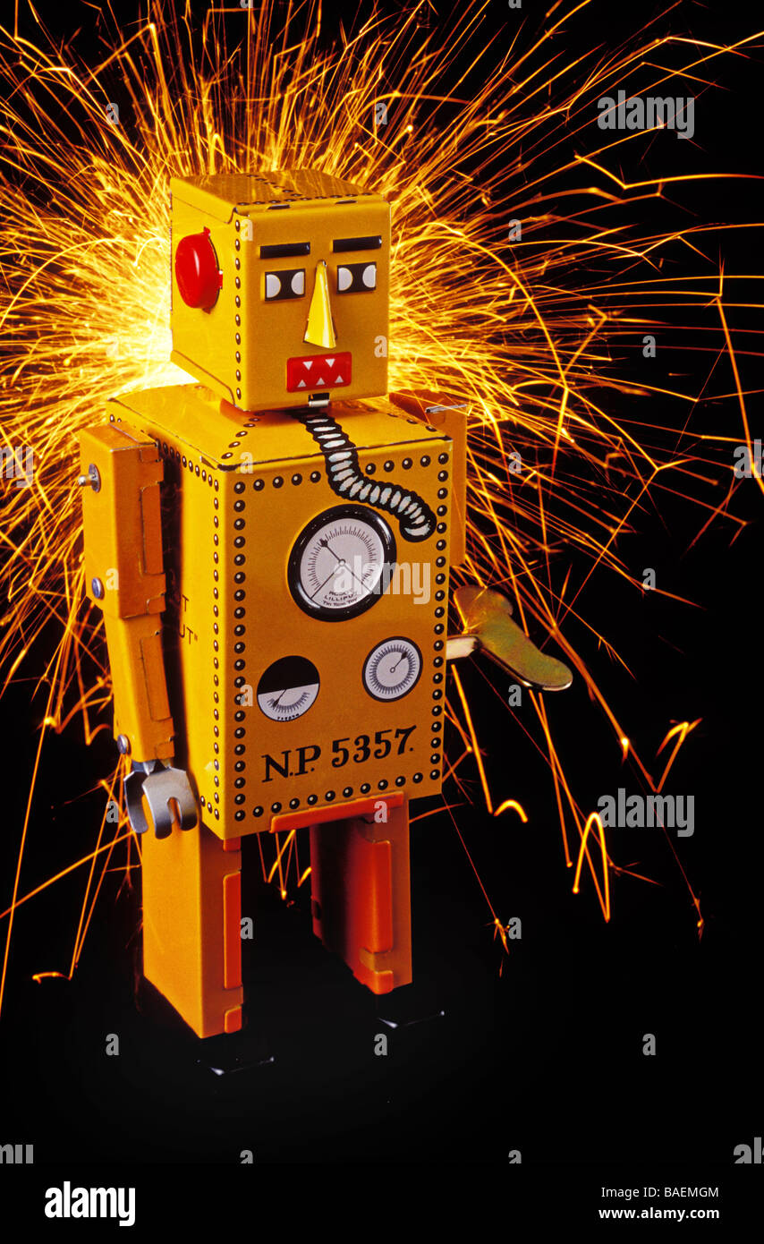 Yellow robot with sparks Stock Photo - Alamy