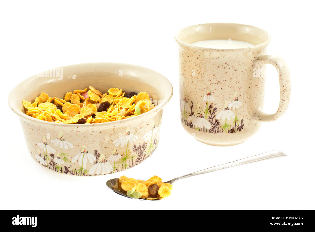 cornflakes with milk in a cup on a white background Stock Photo - Alamy