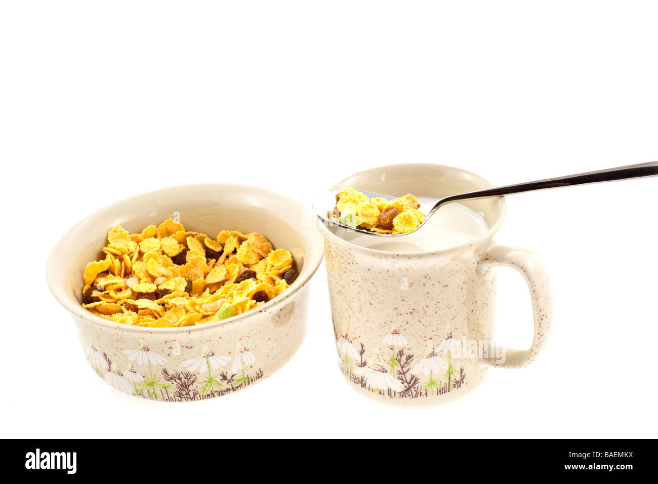cornflakes with milk in a cup on a white background Stock Photo - Alamy