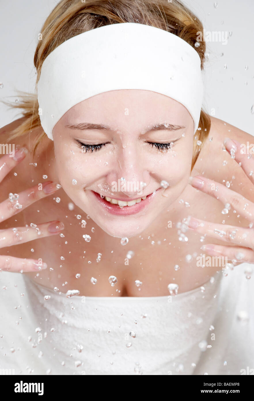 happy young girl wash her face Stock Photo - Alamy