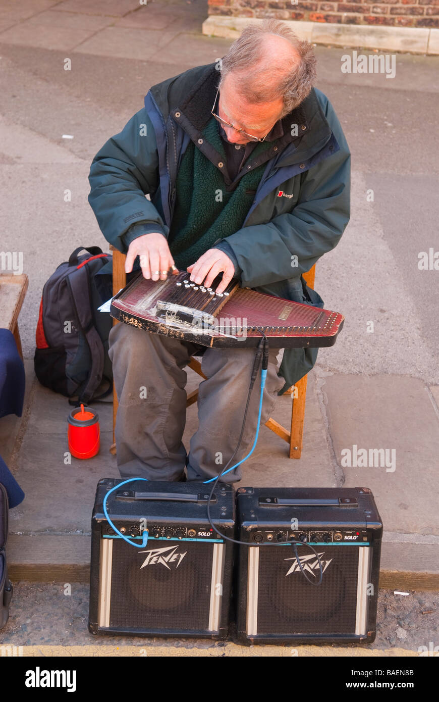 Man busking in street playing hi-res stock photography and images - Alamy