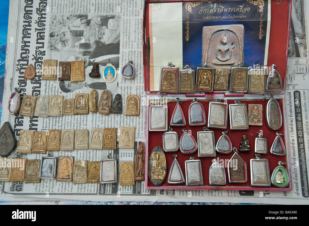 Good luck Buddhist Amulets laid out in one of the amulet markets in ...