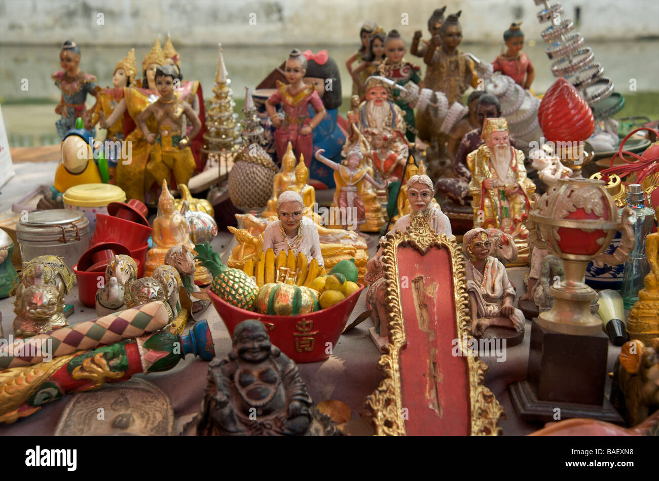 A close up of Buddha images and talisman trinkets in the amulet market ...