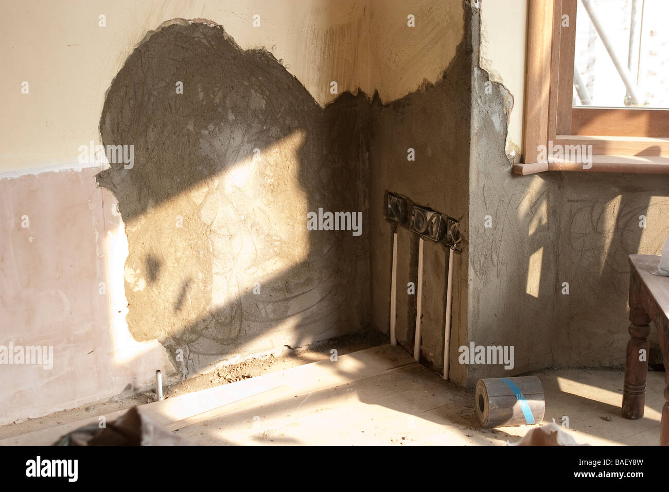 A replastered bay window in a house being renovated an rewired Stock ...