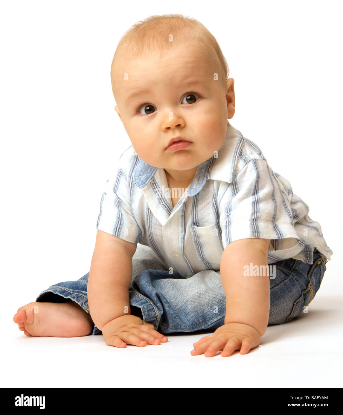 A baby leans forward with curiosity on a white background Stock Photo ...