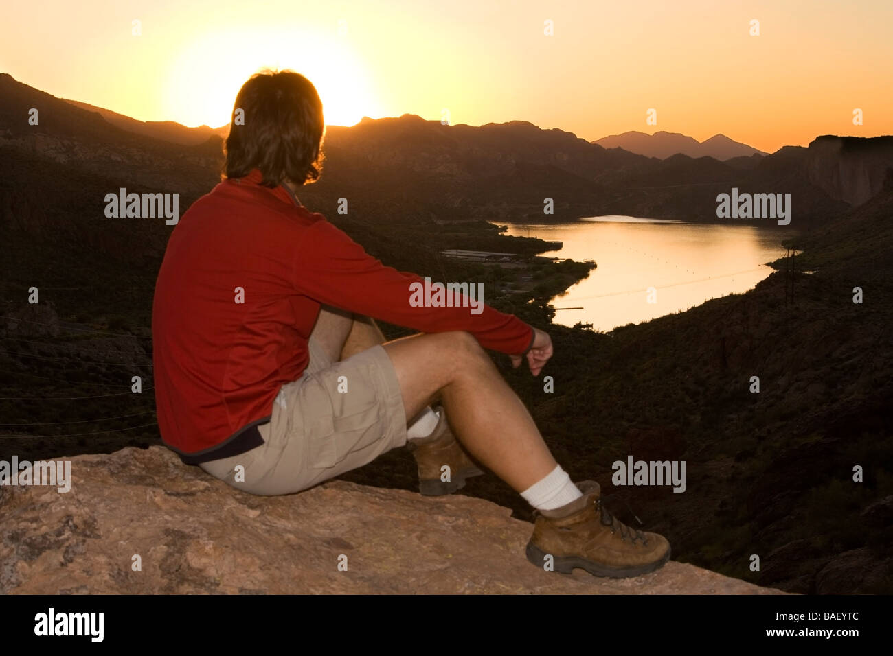 Man sitting rock lake hi-res stock photography and images - Alamy