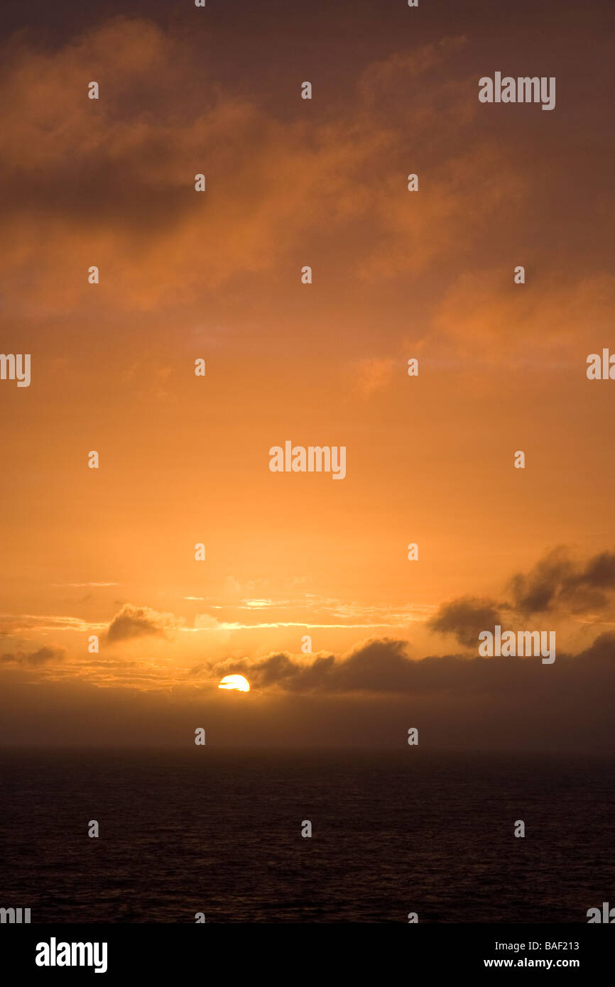 Sunset over the water Stock Photo - Alamy