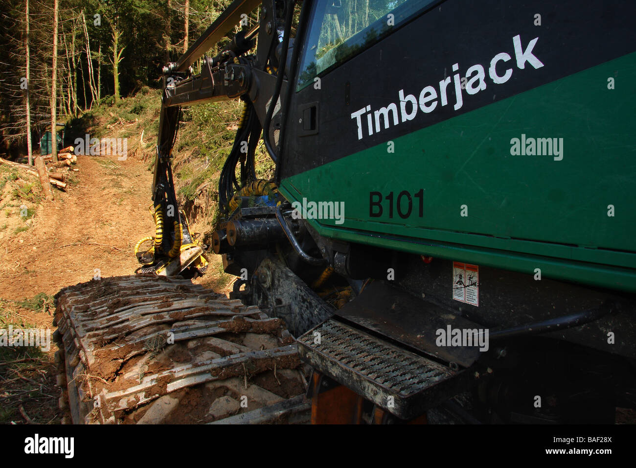 A Timberjack logging machine in woodland Limousin France Stock Photo ...