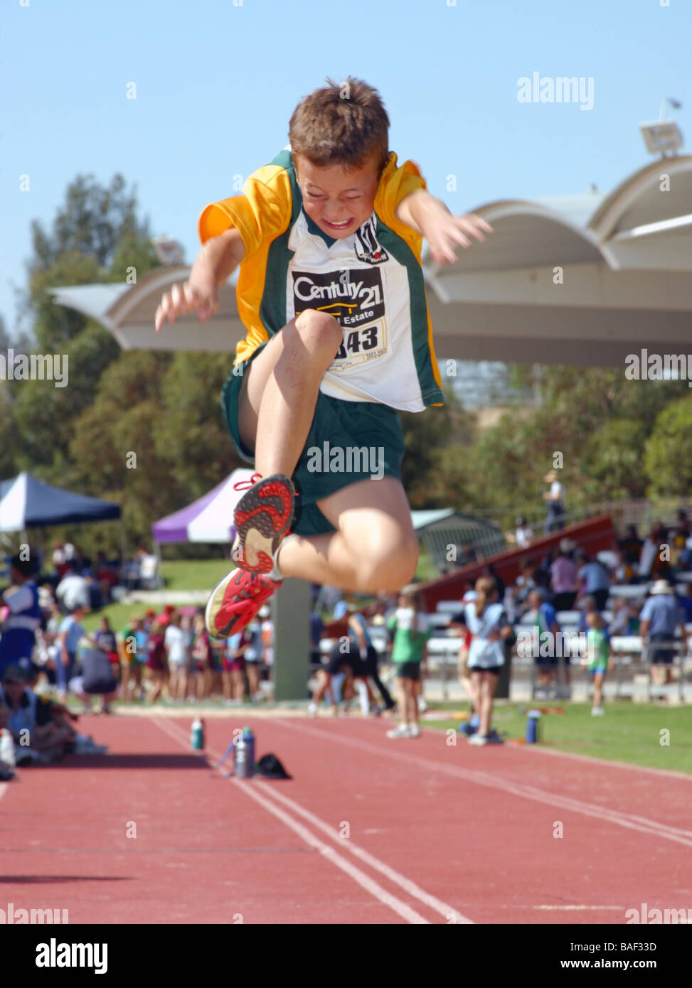 Young Athlete competing in long jump Stock Photo - Alamy