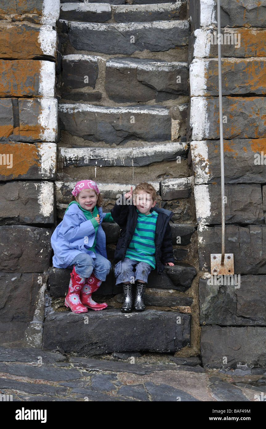 Children on steps, Newquay harbour Stock Photo - Alamy