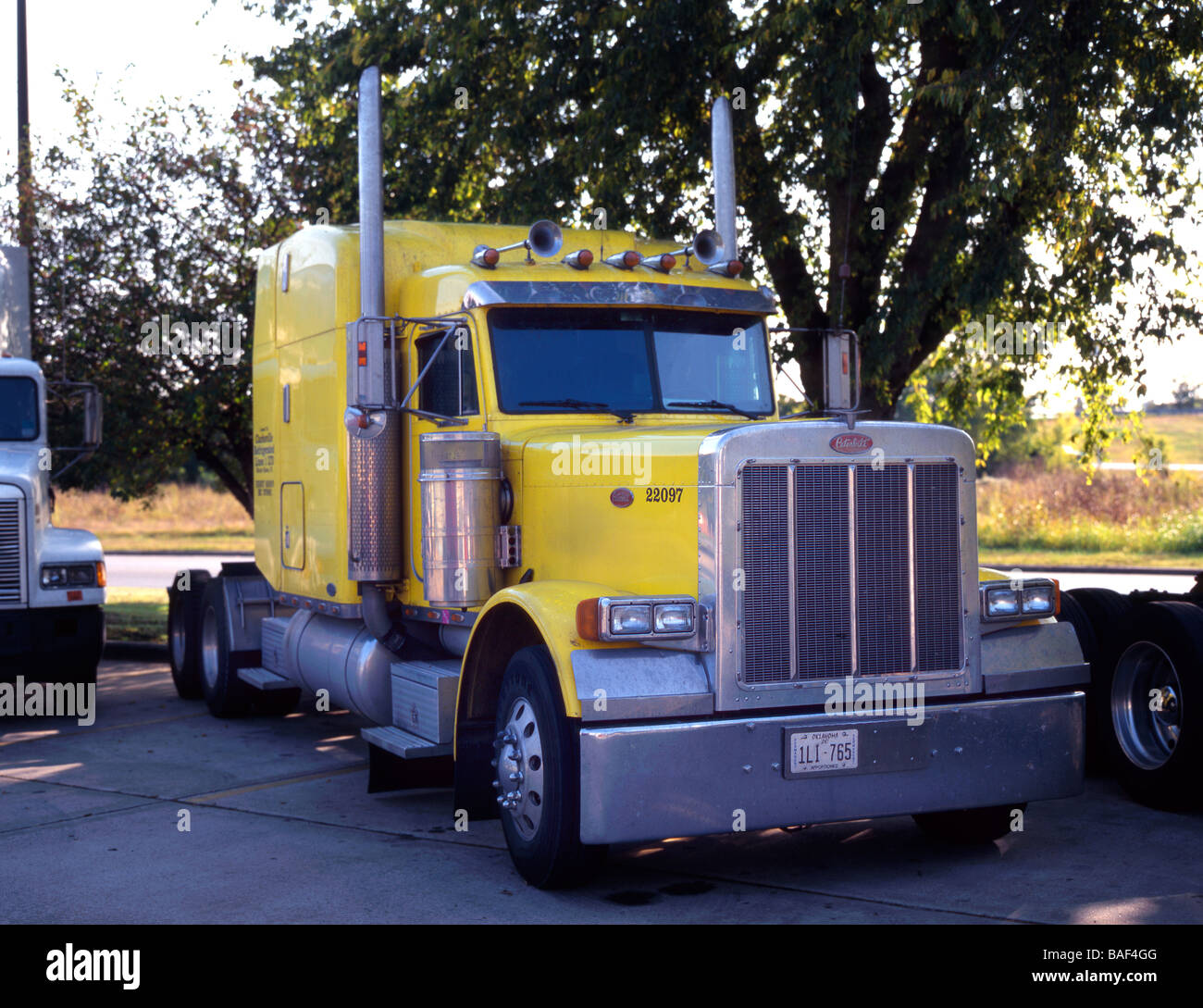 A parked large American yellow truck Stock Photo - Alamy
