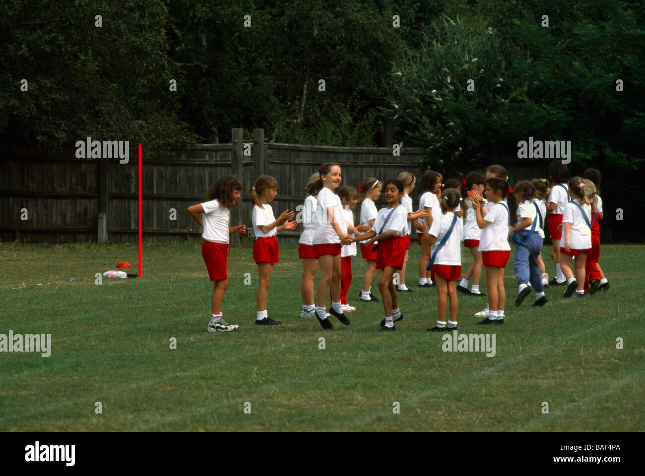 Primary School Children Doing Country Dancing On Sports Day Stock Photo ...