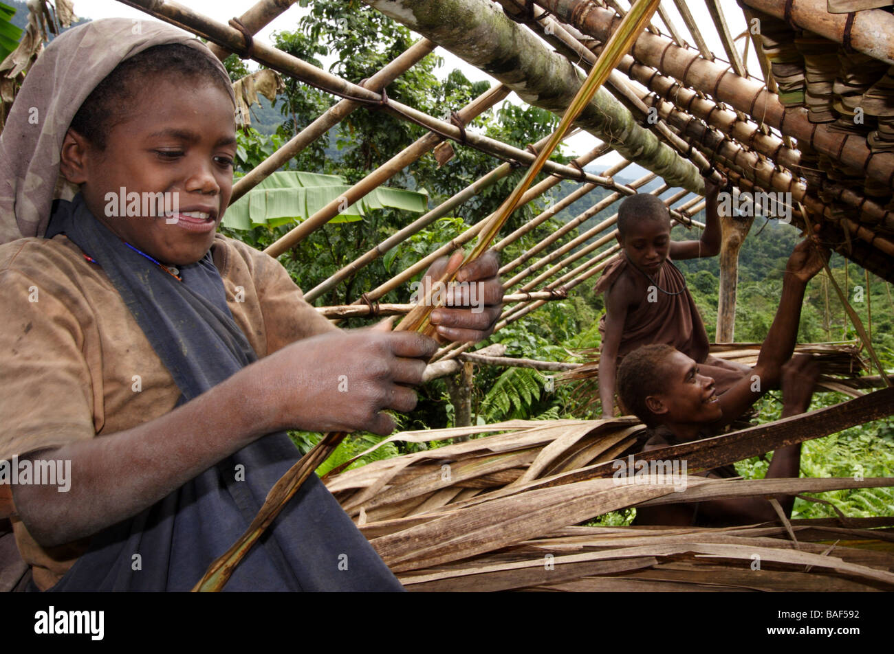 Constructing a primitive family home at Ora Village on the tiny island ...