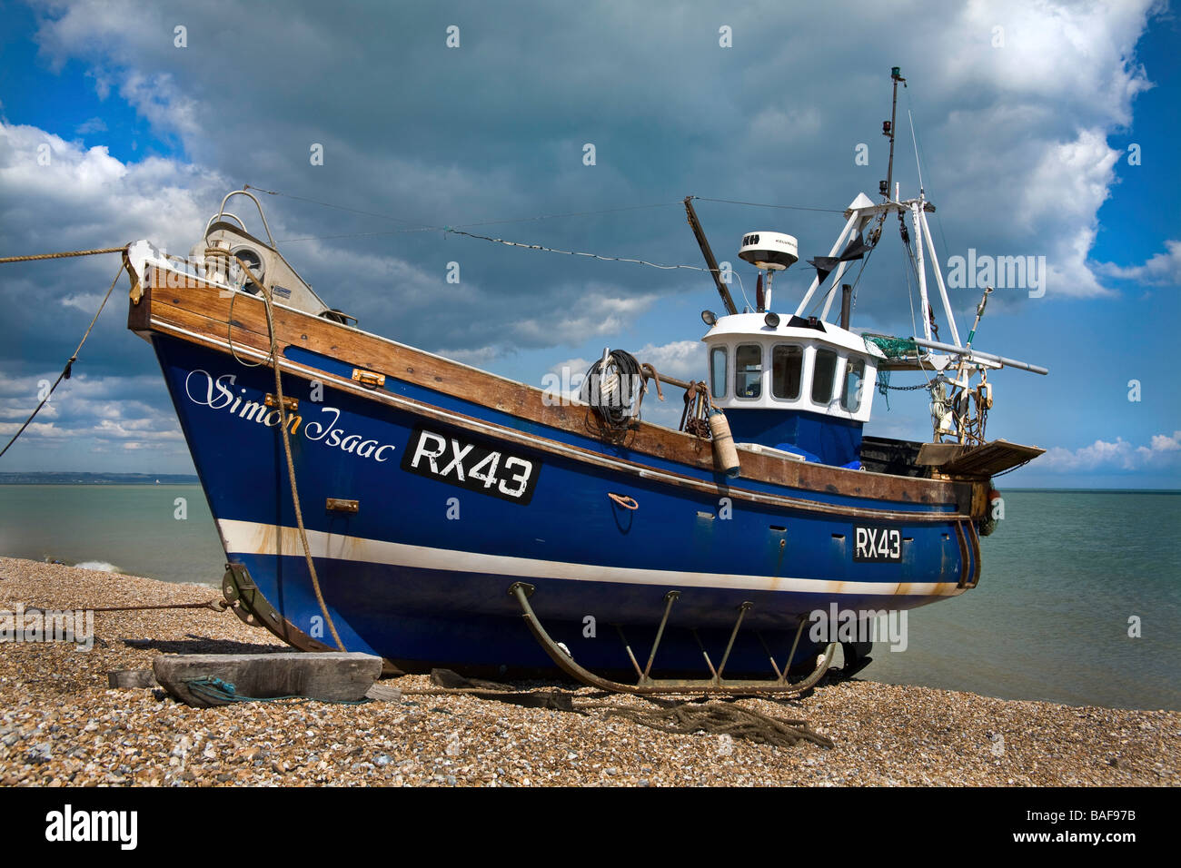 Blue fishing boat Stock Photo - Alamy