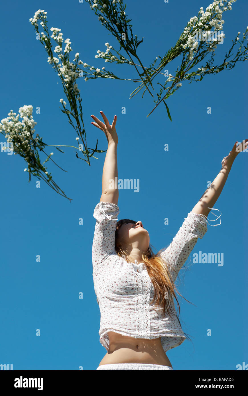 Girl throws flowers hi-res stock photography and images - Alamy