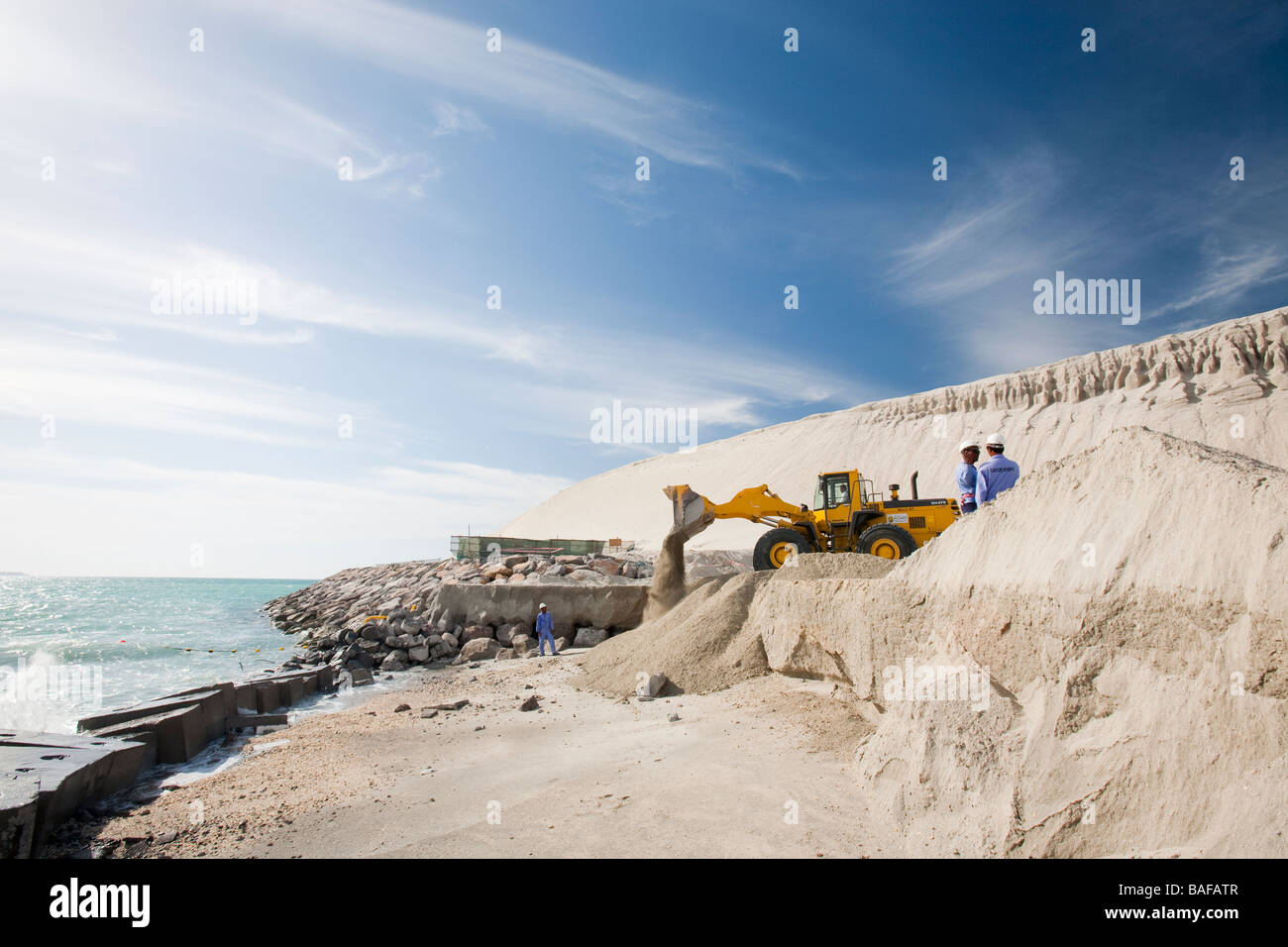 Arab workers working on a reclamation scheme to build another exclusive ...