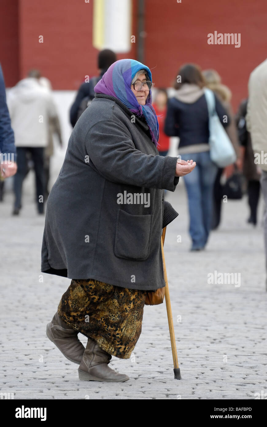 Poor Russian old woman begs at front of the Russian church near Moscow ...
