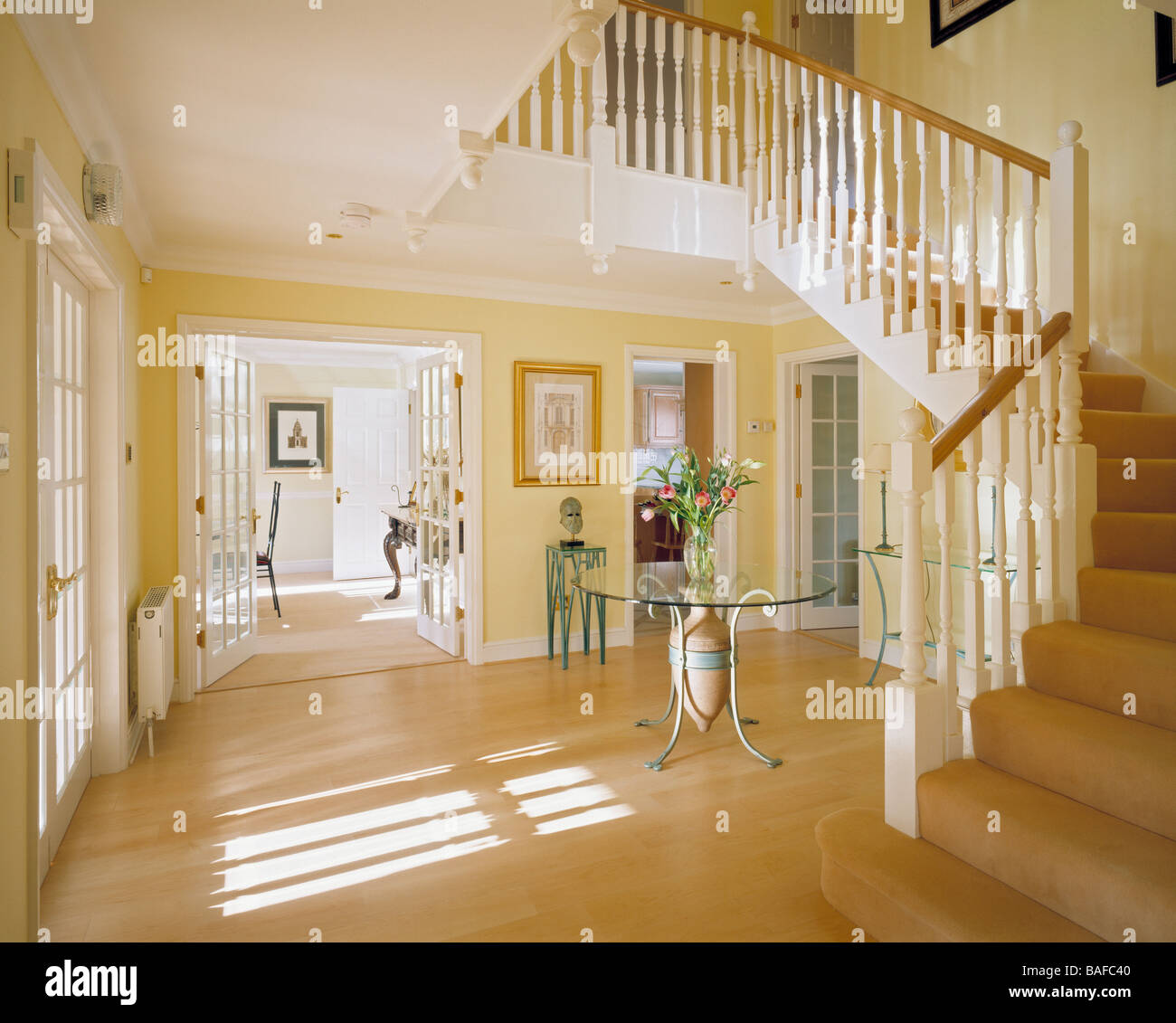 a magnificent entrance hallway with winding stairs Stock Photo - Alamy