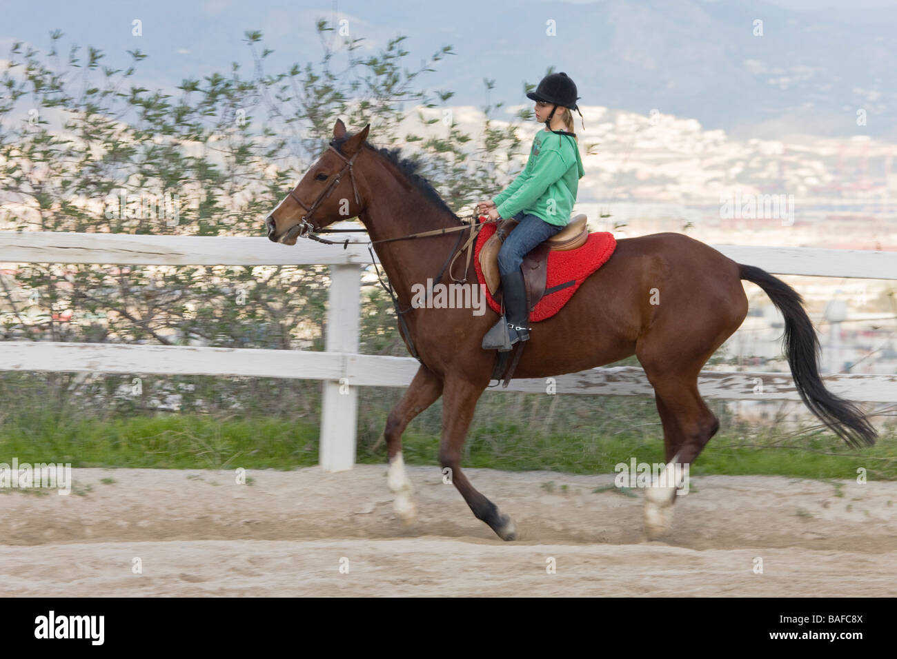 Girl horseback riding Stock Photo - Alamy