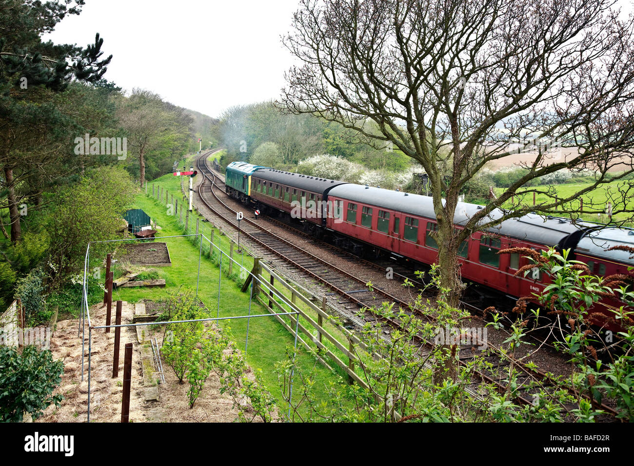 A "Diesel Locomotive" pulls out of "Weybourne Station" on the "North ...