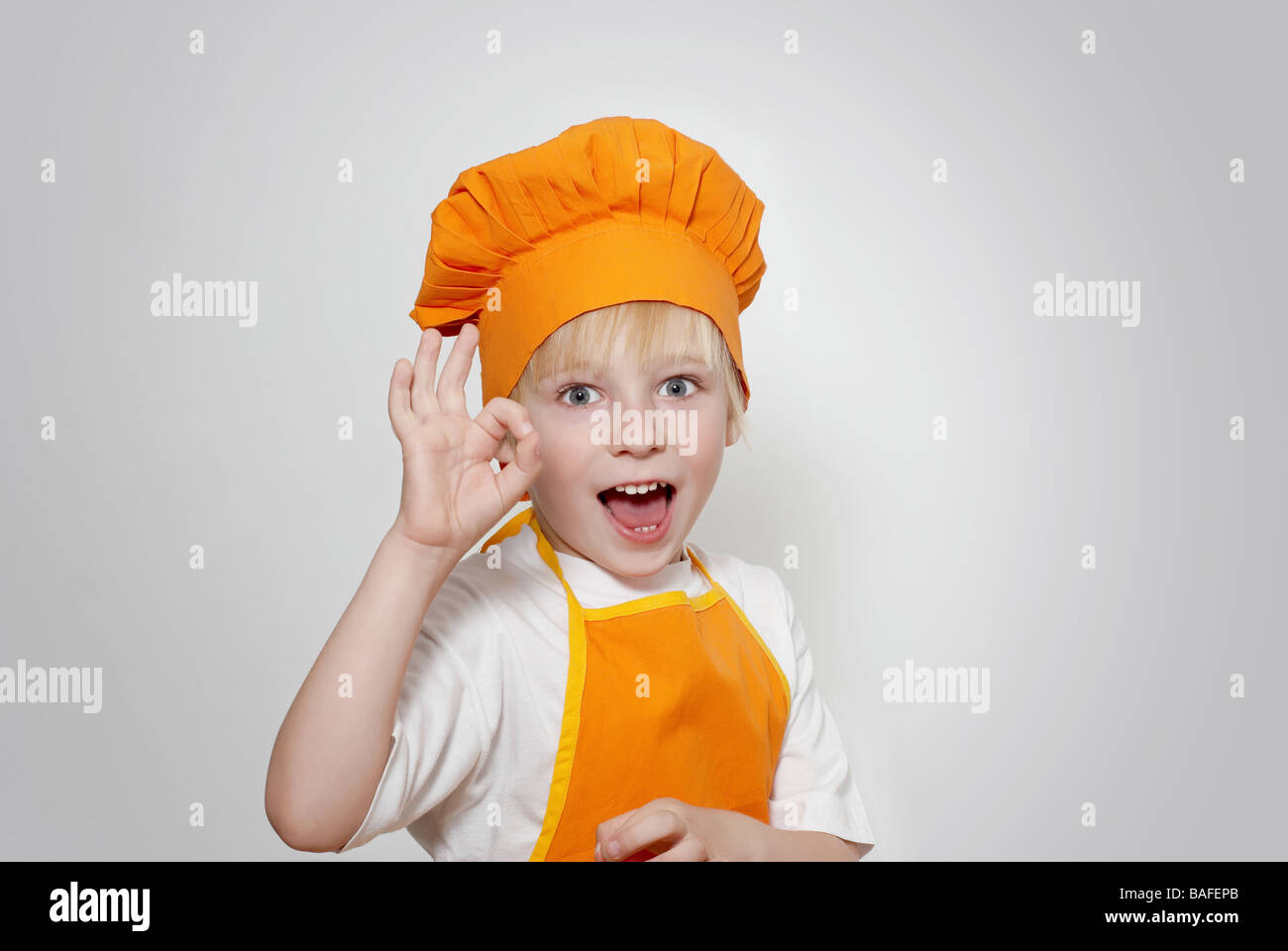 Portrait of the little cook Stock Photo - Alamy
