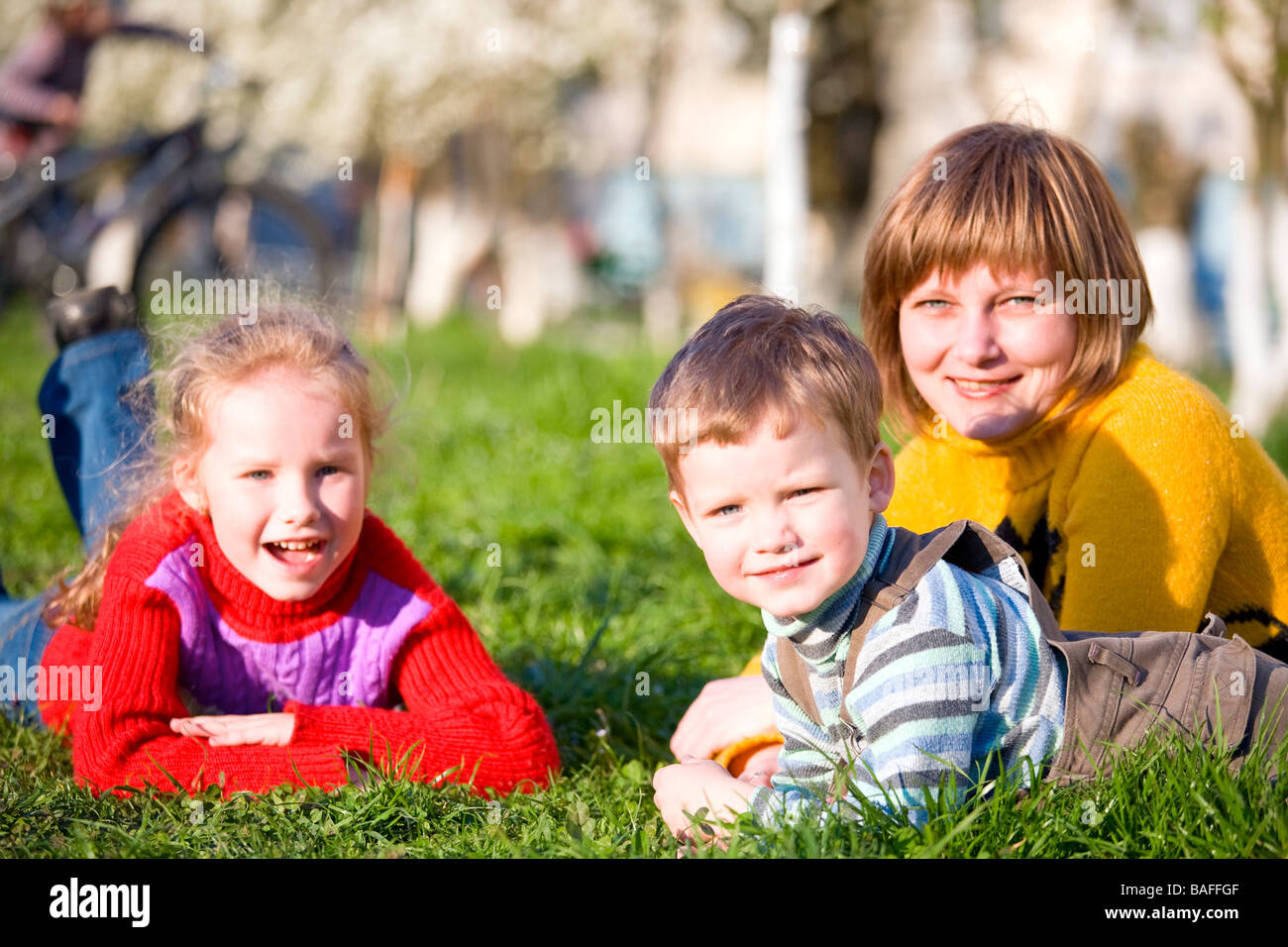 Happy mother with small children in spring recreation ground Stock ...