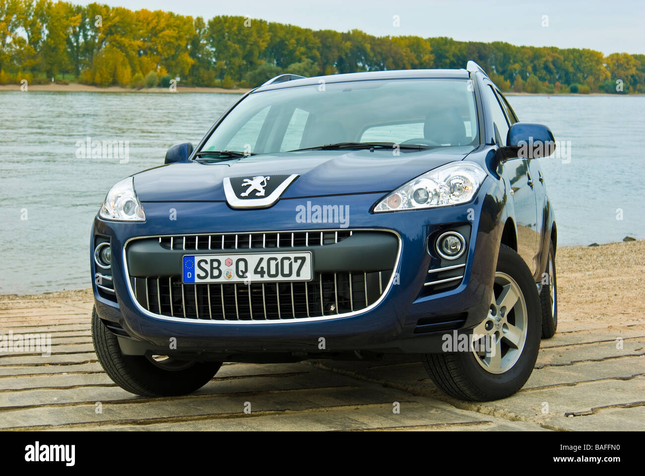 Blue Peugeot 4007 SUV at Rhine river front view Stock Photo - Alamy