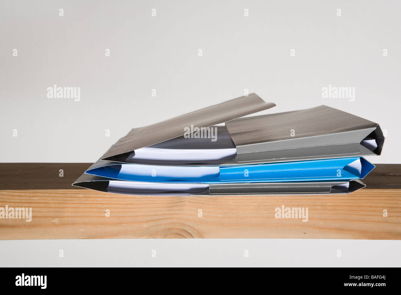 Three files on a shelf Stock Photo - Alamy