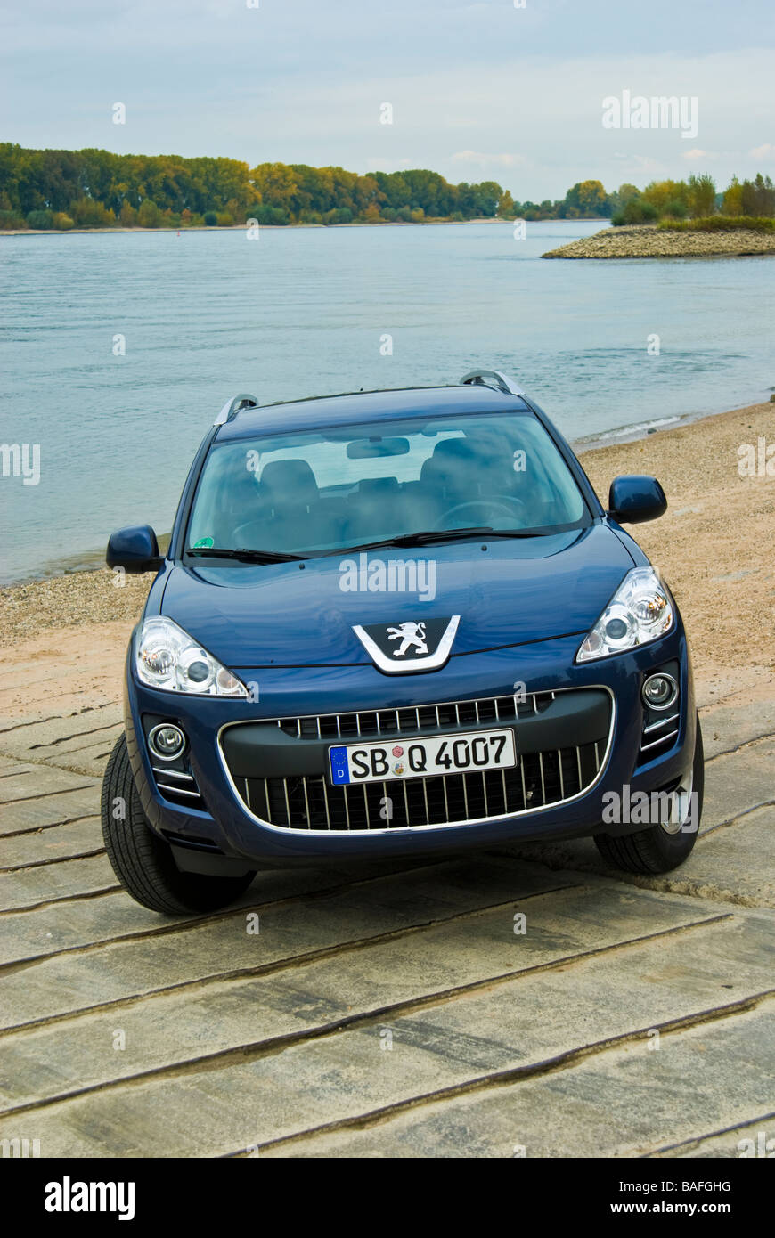 Blue Peugeot 4007 SUV at Rhine river front view Stock Photo - Alamy