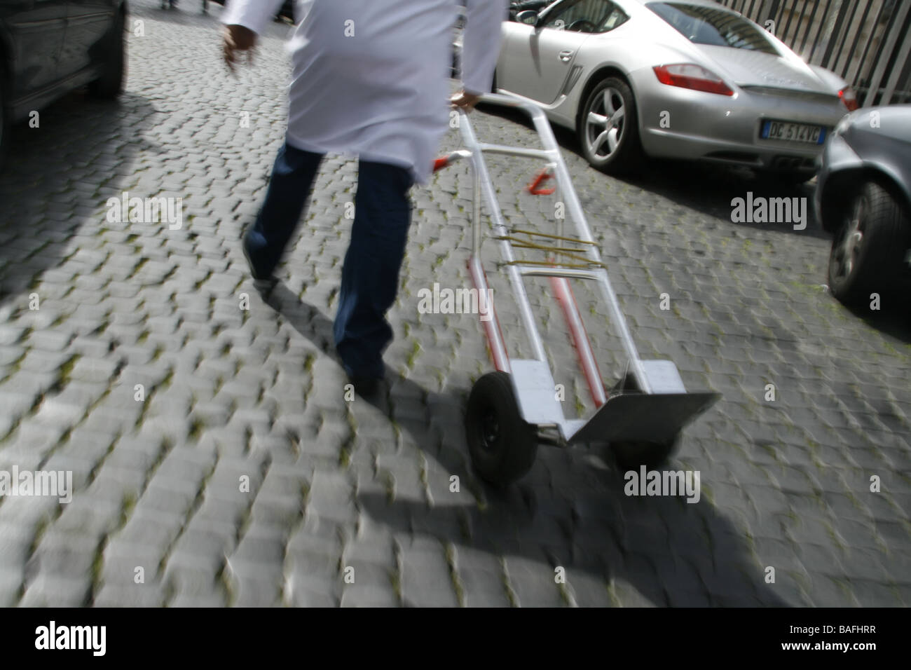 Delivery man empty trolley hi-res stock photography and images - Alamy