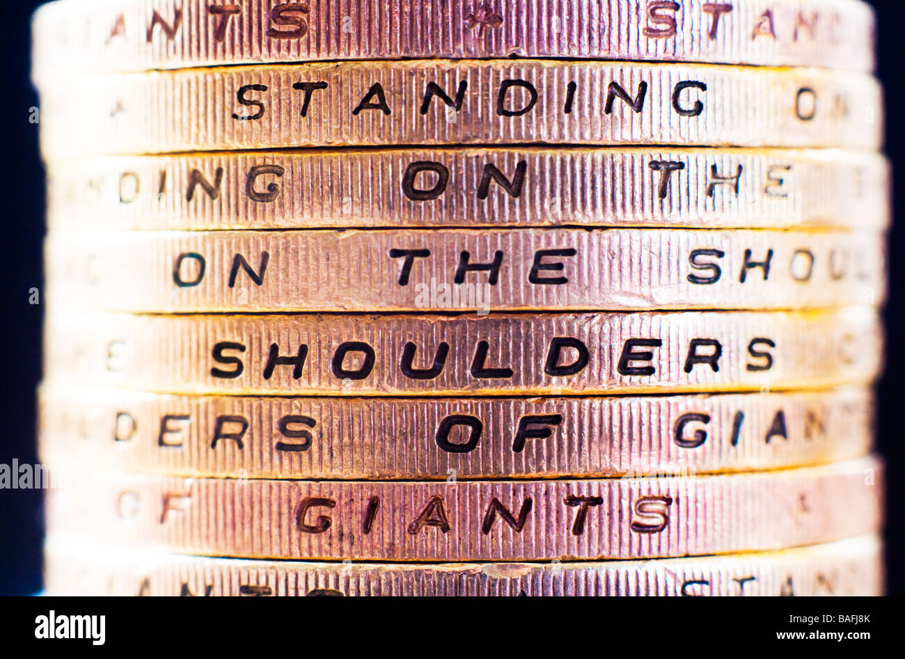 Detail of writing around the edge of British £2 coins 'Standing in the ...