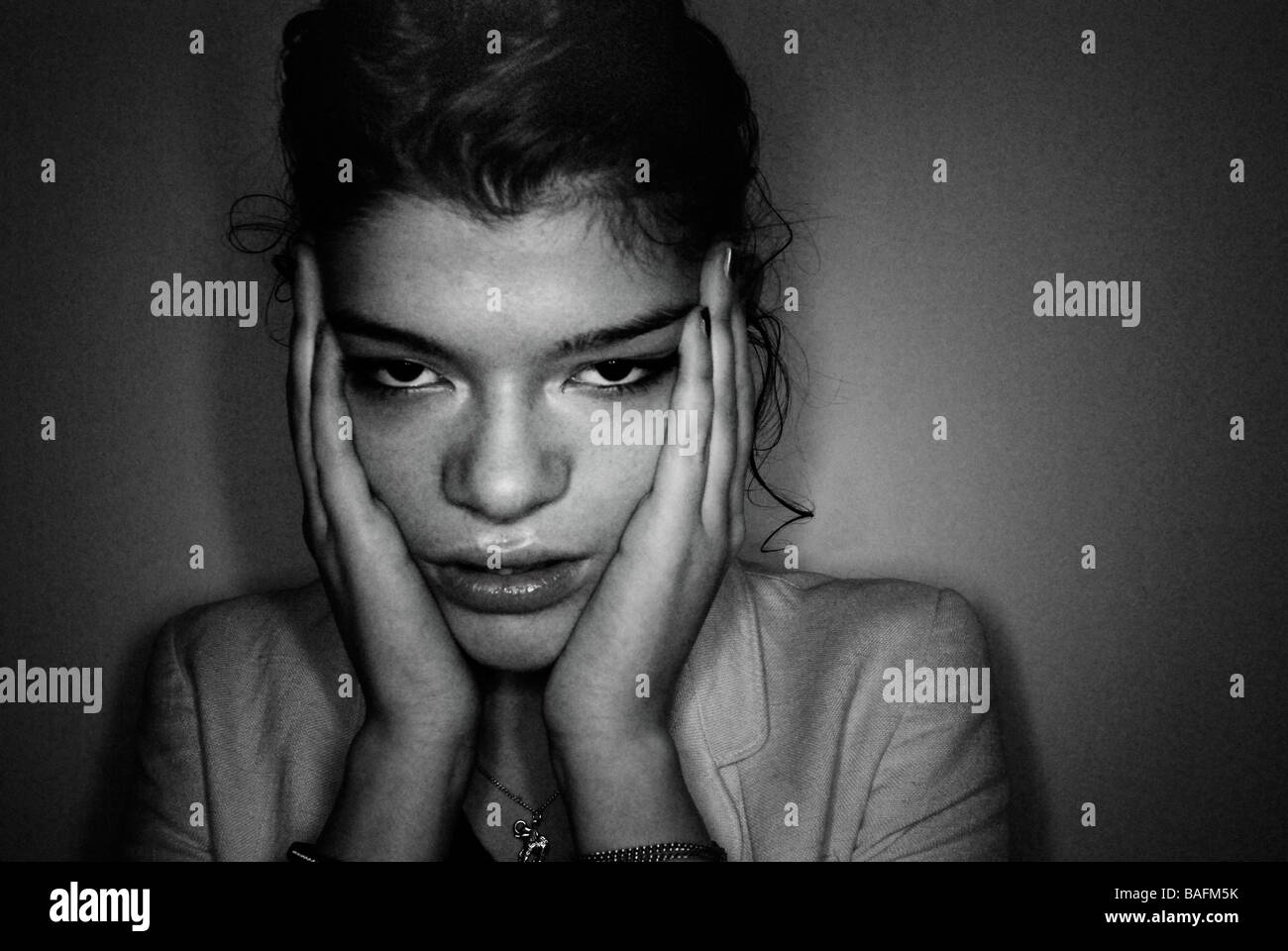 young girl stretches face in black & white Stock Photo - Alamy