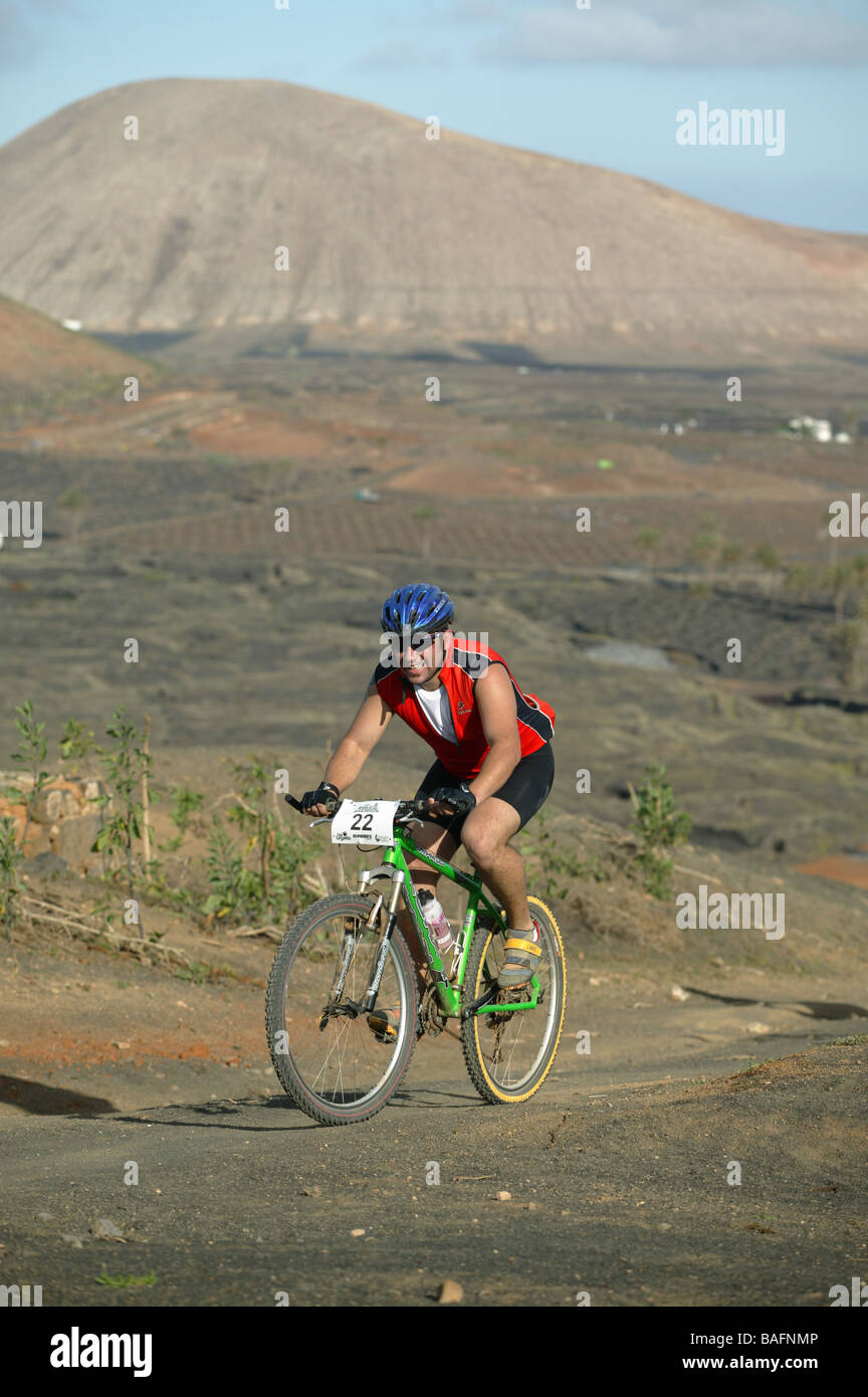 A Mountain biker racing his MTB in rocky terrain Stock Photo - Alamy