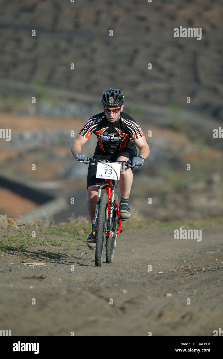 A Mountain biker racing his MTB in rocky terrain Stock Photo - Alamy