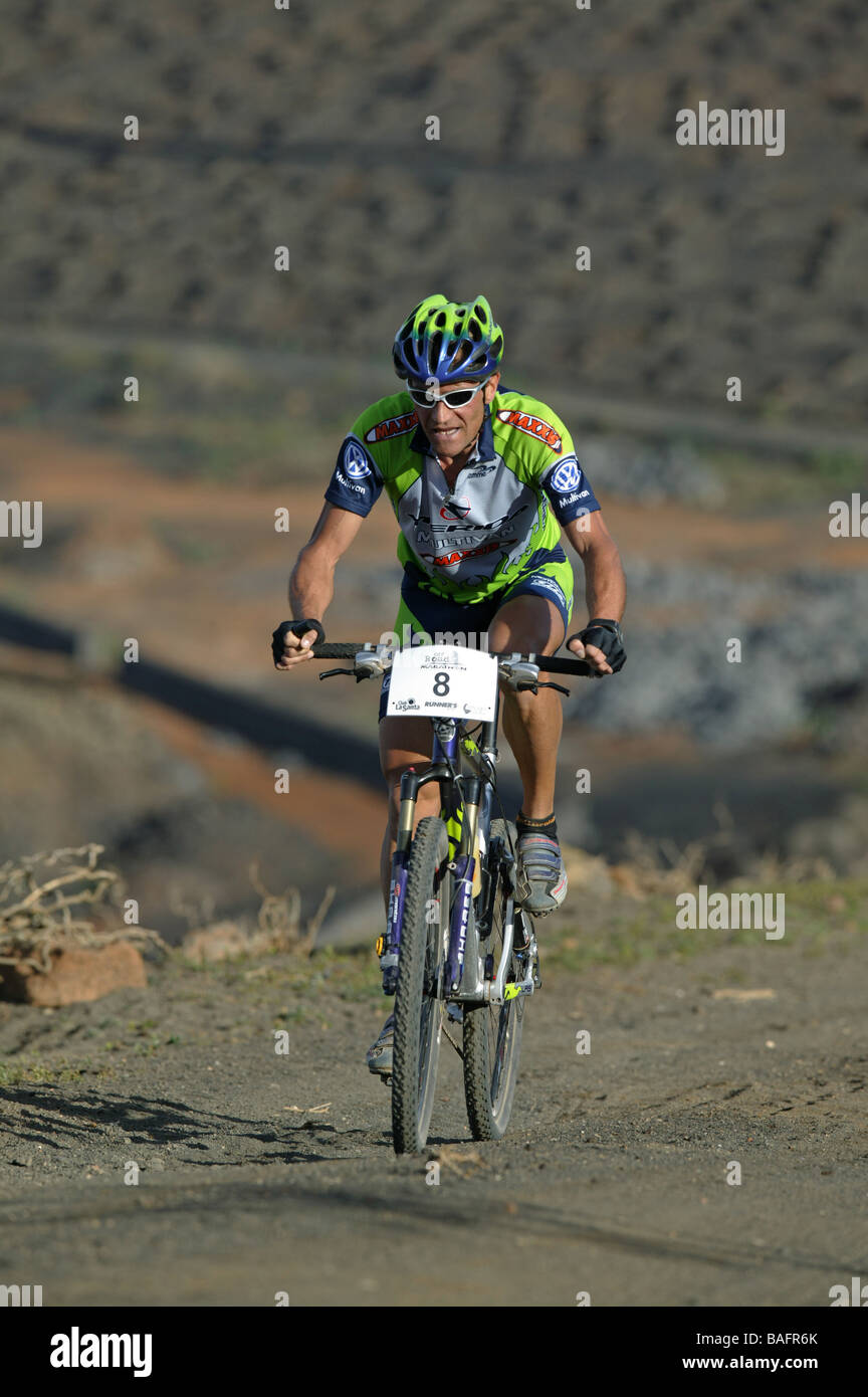 A Mountain biker racing his MTB in rocky terrain Stock Photo - Alamy