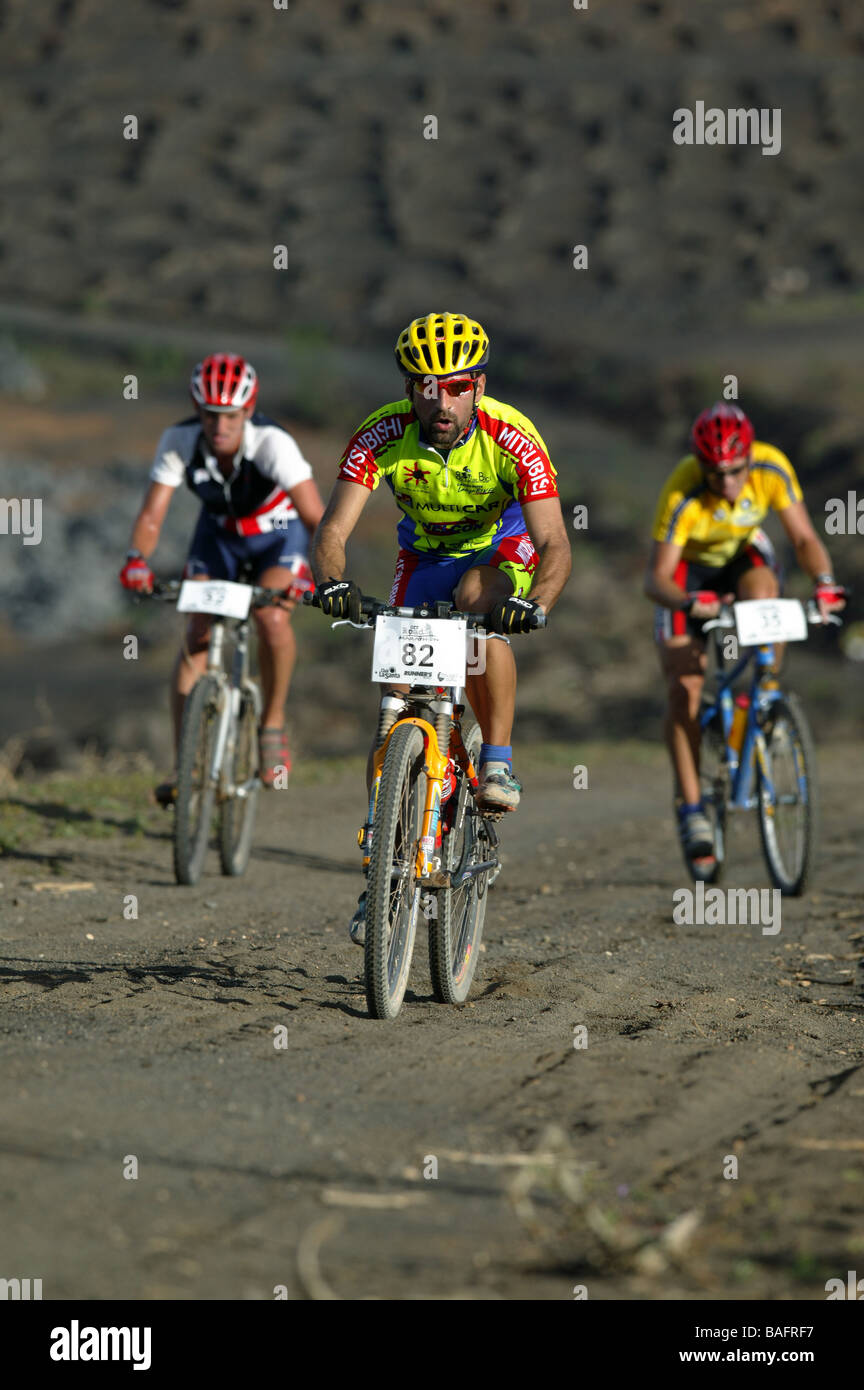 Mountain bikers racing in rocky terrain Stock Photo - Alamy