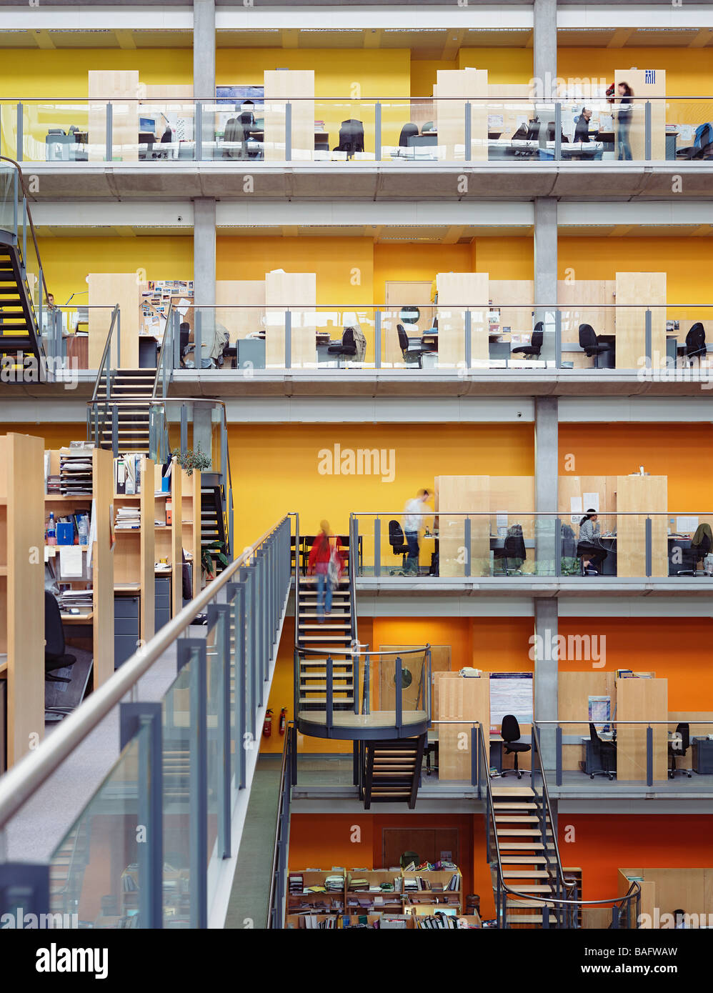 bms building atrium coloured wall with workstations Stock Photo - Alamy
