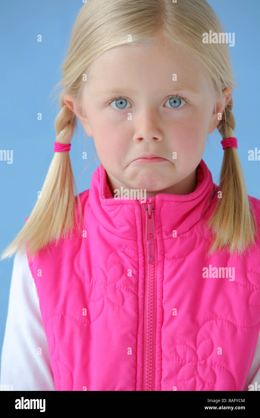 Young girl frowning Stock Photo - Alamy