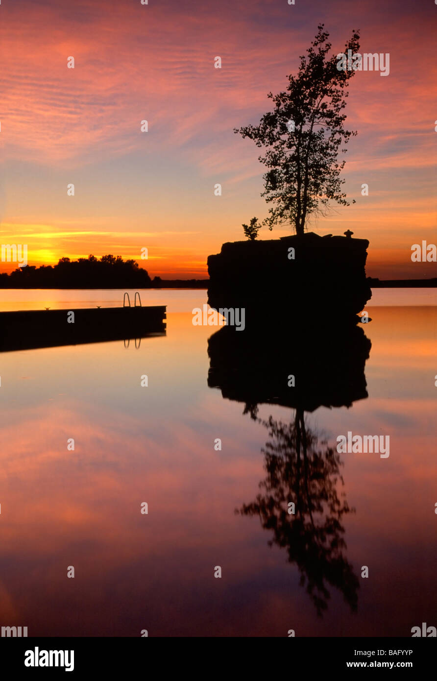 A spectacular Canadian sunset displaying silhouettes and their ...