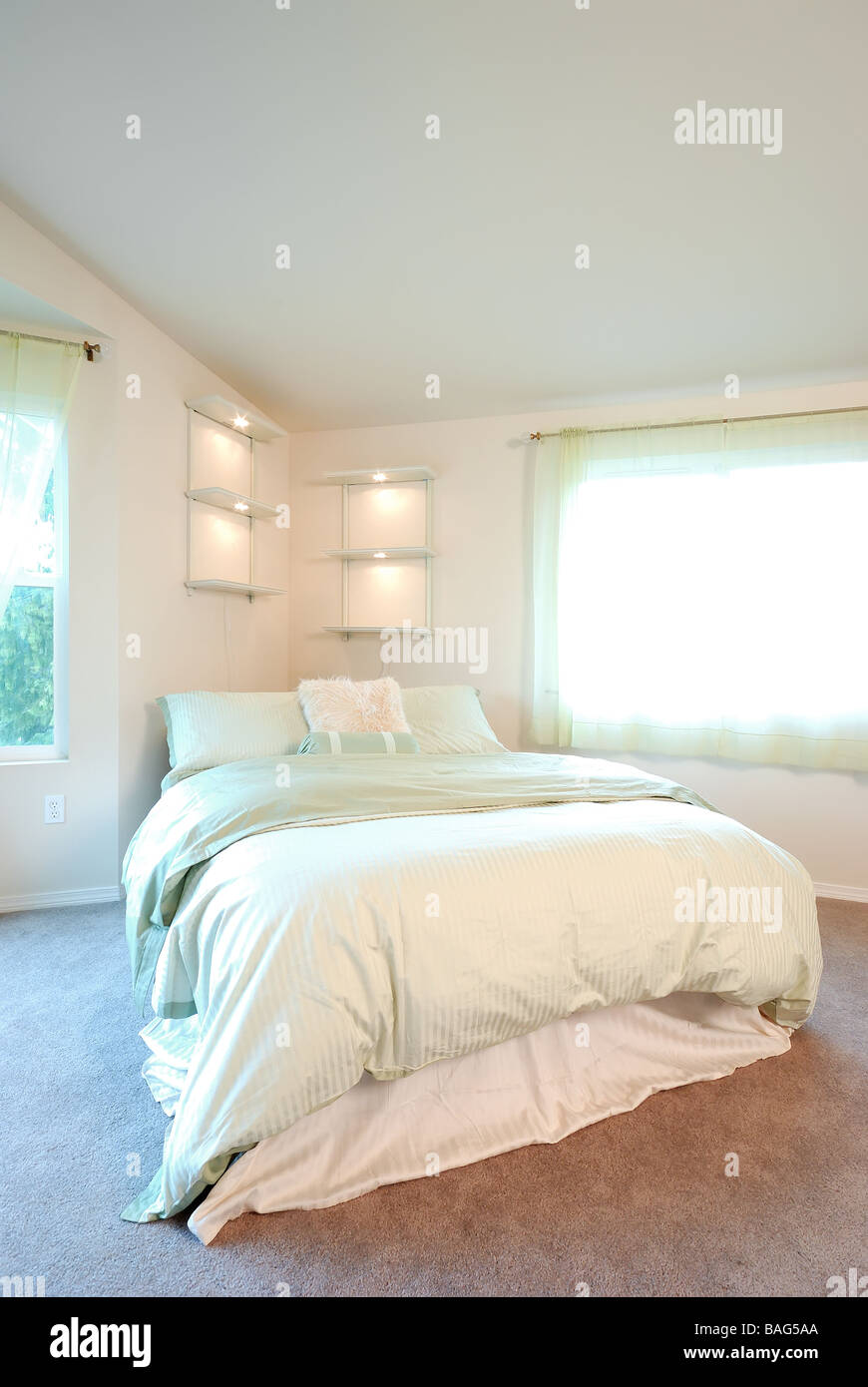 Bed in master bedroom Stock Photo - Alamy