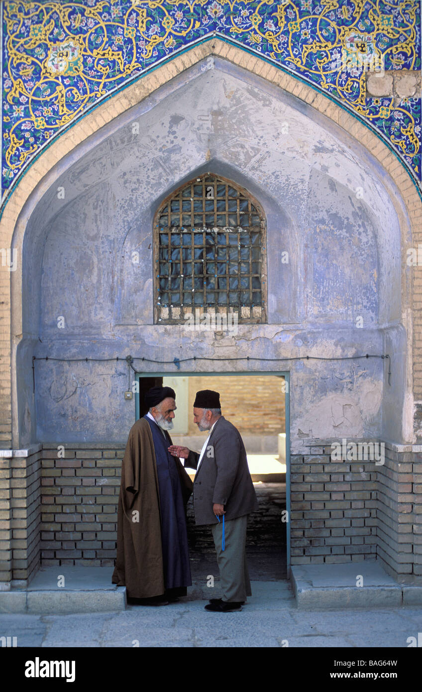 Iran, Isfahan Province, Esfahan, mollah and devotee in front of a ...
