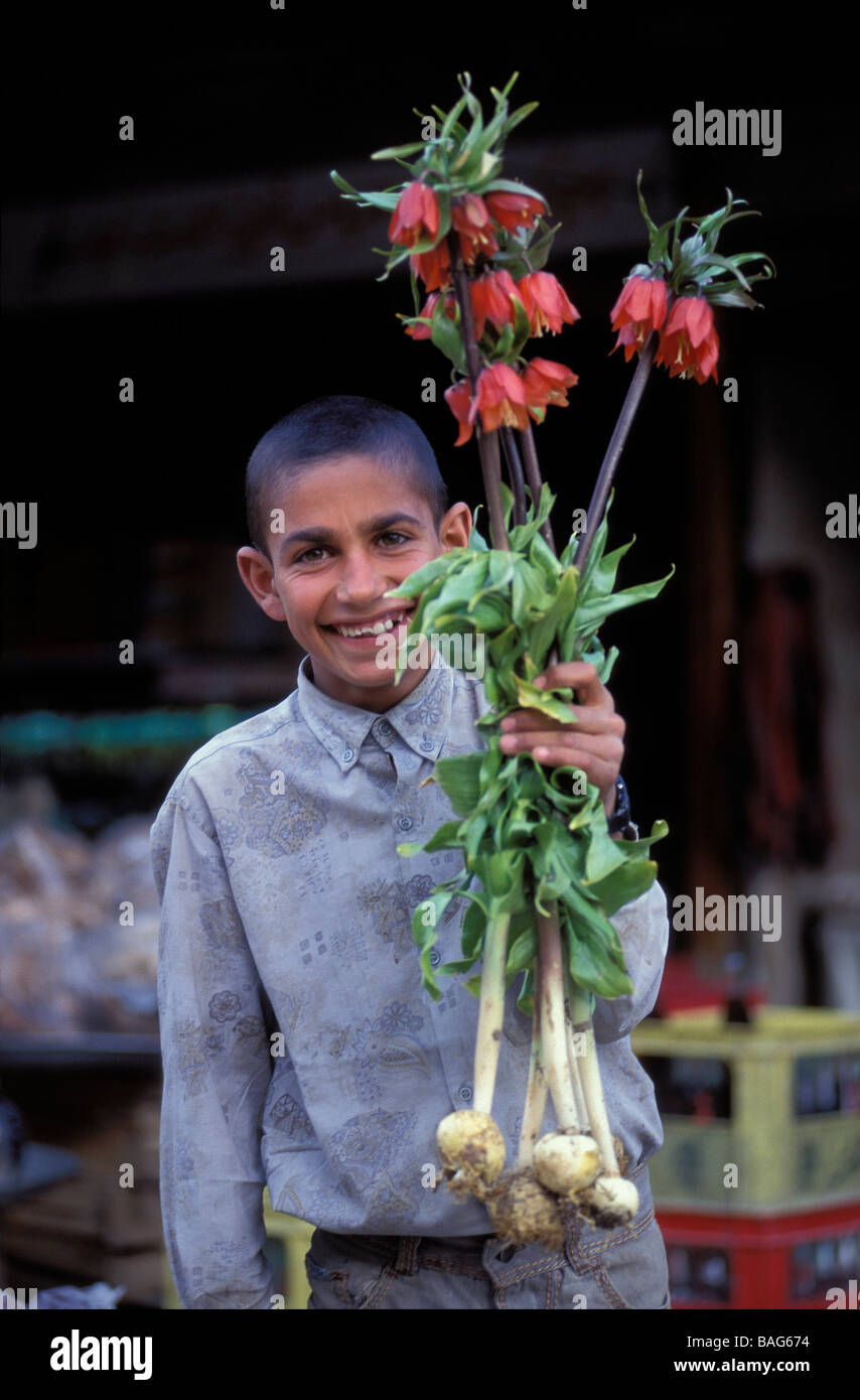 Child selling flowers hi-res stock photography and images - Alamy