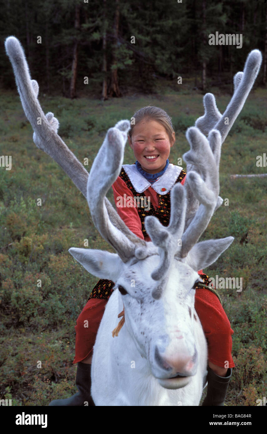 Mongolia, Khovsgol Province, red taiga, Tsaatan little girl riding a ...