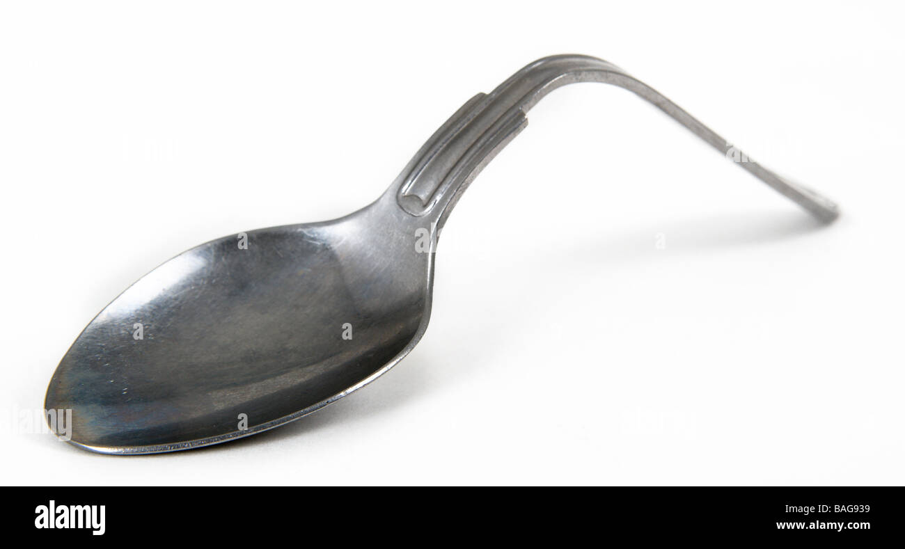 Spoon bending Cut Out Stock Images & Pictures - Alamy