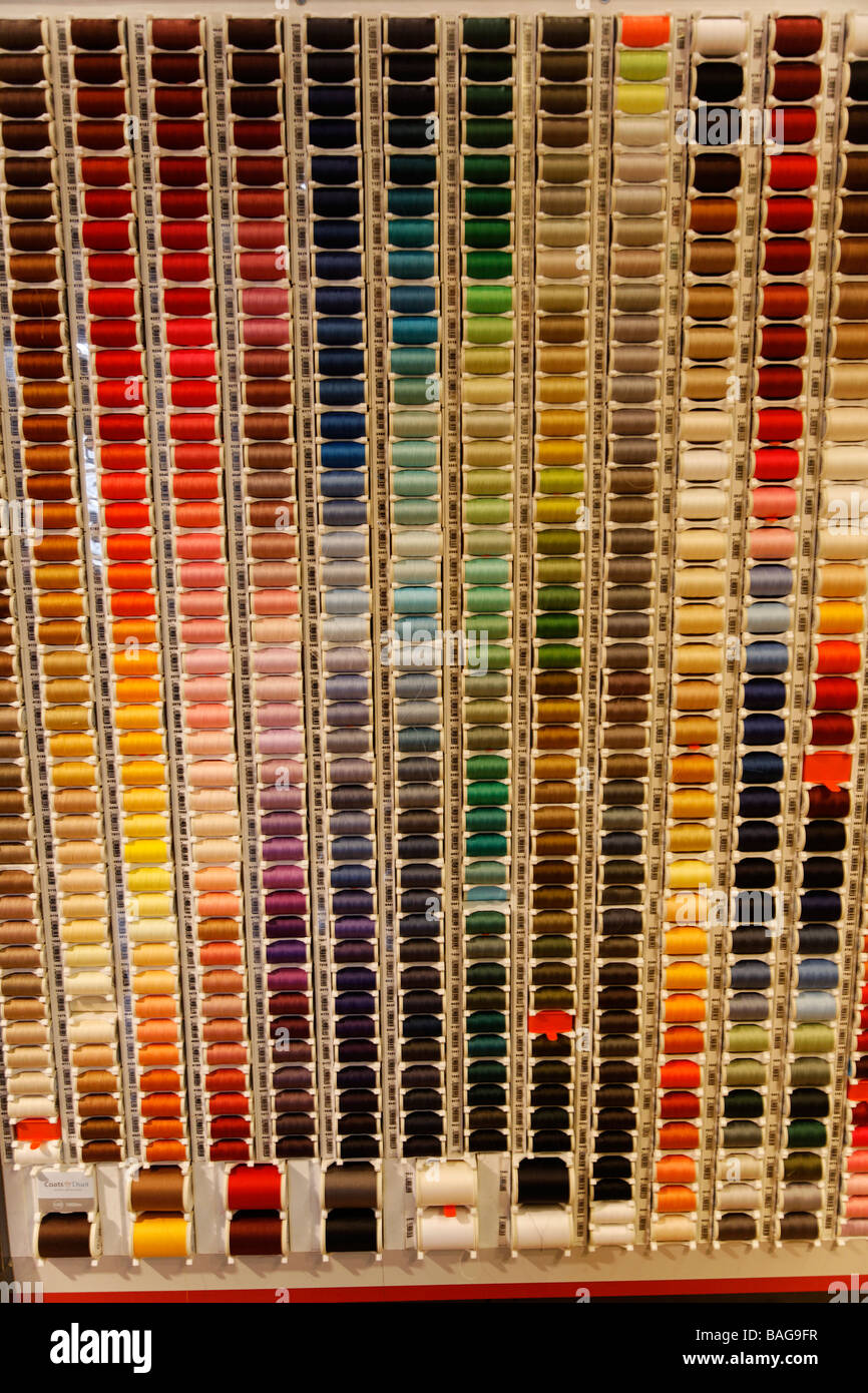 Cotton reels of different colour on display Stock Photo - Alamy