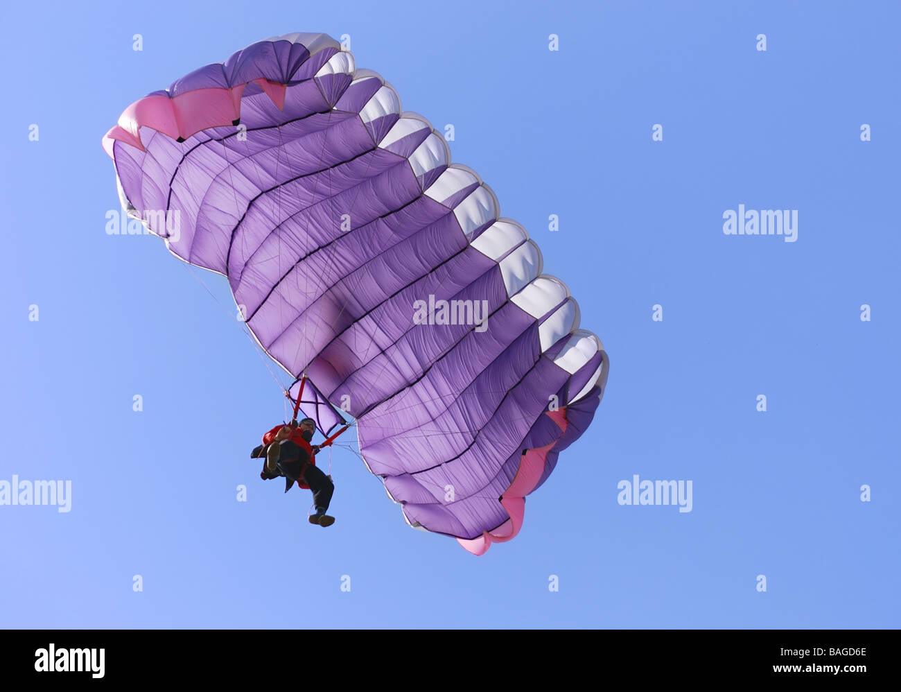 A purple parachute on a bright sunny day Stock Photo - Alamy