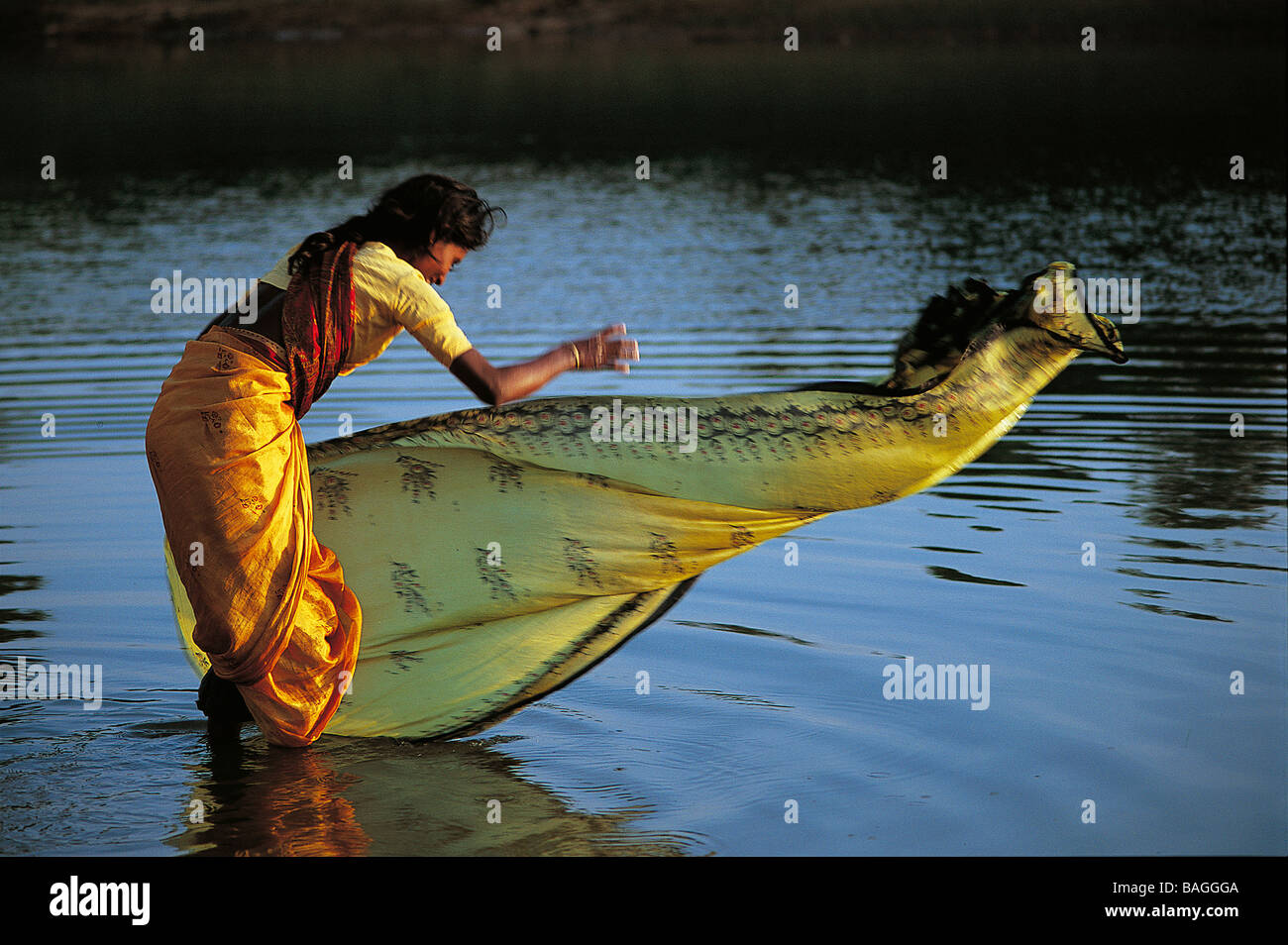 India, Karnataka, surroundings of Mysore, woman washing a sari Stock ...