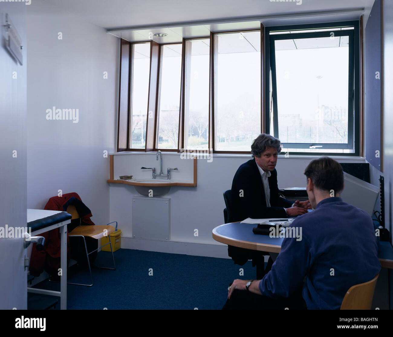 surgery consulting room with patient and doctor Stock Photo - Alamy